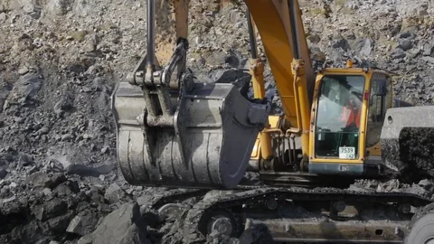 Extraction of coal in a quarry by an exc... | Stock Video | Pond5
