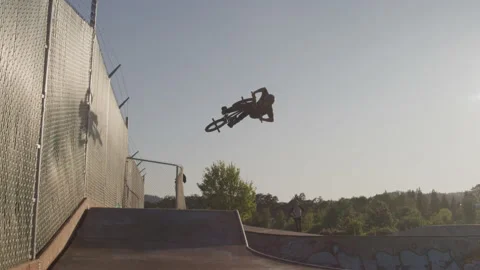 Extreme BMX Biker Jumping Off a Ramp at ... | Stock Video | Pond5