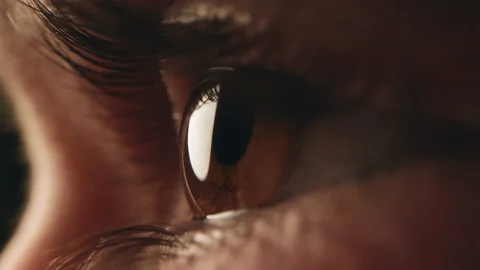 Extreme close-up of a blinking eye in sl... | Stock Video | Pond5