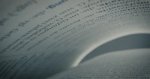 Extreme close-up of book page slowly fal... | Stock Video | Pond5