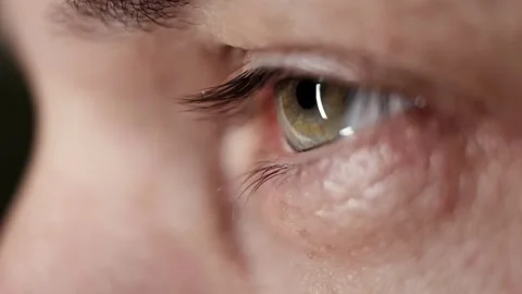 Extreme close-up of a man's eye opening.... | Stock Video | Pond5