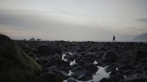 Extreme wide shot of a person walking at... | Stock Video | Pond5