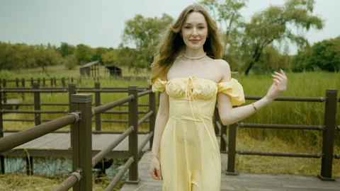 Exuberant woman turning on while walking... | Stock Video | Pond5