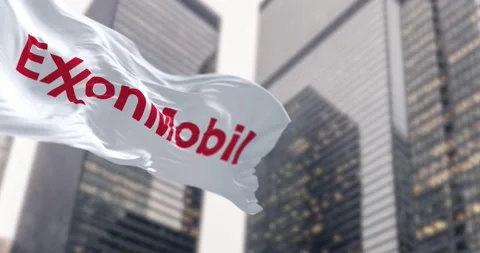 ExxonMobil flag waving in the wind in a ... | Stock Video | Pond5