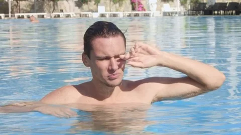 Eye irritation in swimming pool | Stock Video | Pond5