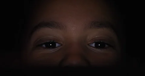 Eyes of a young child watching a digital... | Stock Video | Pond5