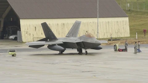 F-22 Raptor tests tail flaps outside han... | Stock Video | Pond5