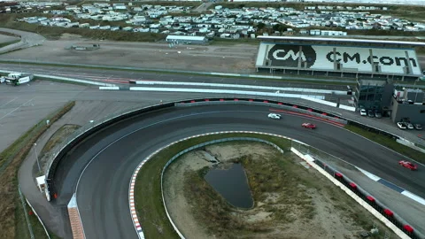 F1 Racing Cars Moving On A Sharp Turn On... | Stock Video | Pond5