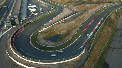 F1 Racing Cars Moving On A Sharp Turn On... | Stock Video | Pond5