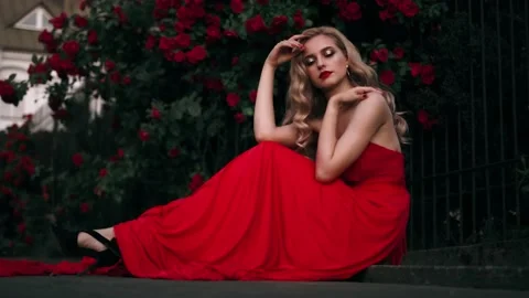 Fabulous girl with red lips in red dress... | Stock Video | Pond5