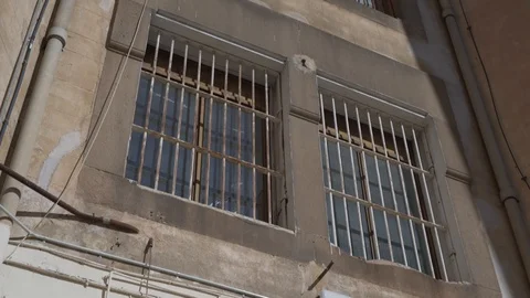 facade of the prison building with spotl... | Stock Video | Pond5