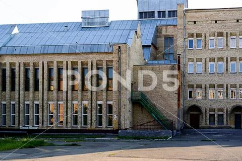 Facade of the two-storey white brick building Stock Photo #79016825