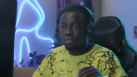 Face of Black Gamer Playing and Sipping ... | Stock Video | Pond5