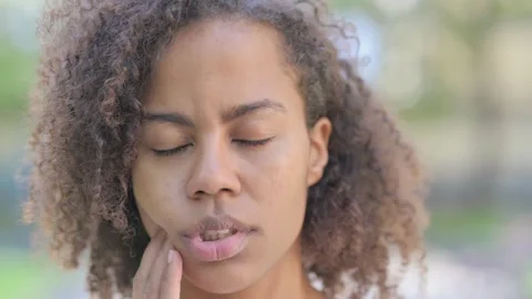 Face Close up of African Woman with Toot... | Stock Video | Pond5