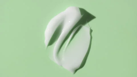 Face cream smears appear from the shadow... | Stock Video | Pond5