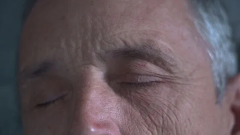 The face of a man falling asleep watchin... | Stock Video | Pond5