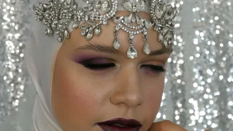 Face of model in a white image and a sil... | Stock Video | Pond5