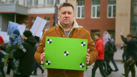 Face portrait of activist with green scr... | Stock Video | Pond5