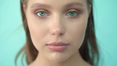 Face of young woman with tear drop close... | Stock Video | Pond5
