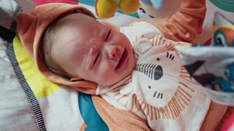 Facial features of the baby scrunched in... | Stock Video | Pond5