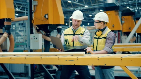 Factory employees are observing manufact... | Stock Video | Pond5