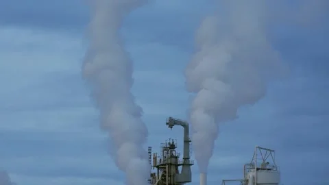 Factory exhaust smoke rising high up in ... | Stock Video | Pond5