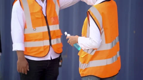 Factory worker in safety dress using alc... | Stock Video | Pond5