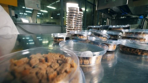 Factory worker is stacking plastic conta... | Stock Video | Pond5