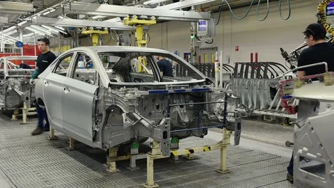 Factory workers in uniform set the hood ... | Stock Video | Pond5