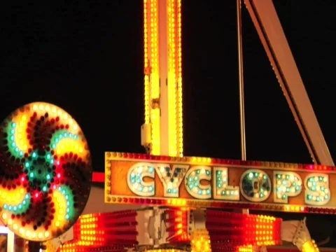 FAIR AMUSEMENT PARK RIDE CYCLOPS LIGHTS | Stock Video | Pond5