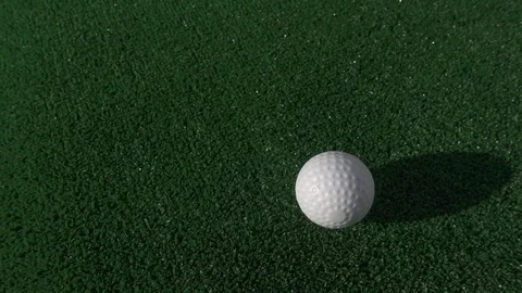 Falling and bouncing golf ball. Ball gam... | Stock Video | Pond5