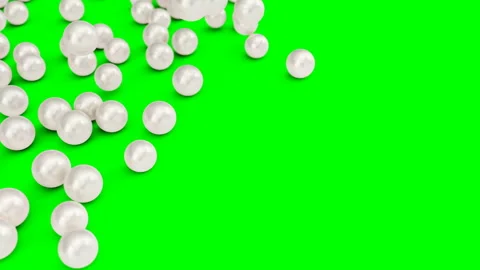 Falling and rolling pearls on a surface ... | Stock Video | Pond5
