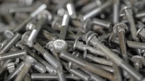 Falling bolts in a box with bots in the ... | Stock Video | Pond5