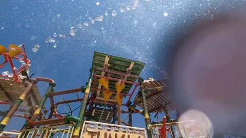 Falling bucket of water in a playground ... | Stock Video | Pond5