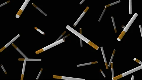 Falling cigarettes on a black background... | Stock Video | Pond5