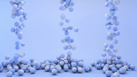 Falling colored balls on light blue back... | Stock Video | Pond5