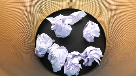 falling crumpled paper ball in a bin top... | Stock Video | Pond5