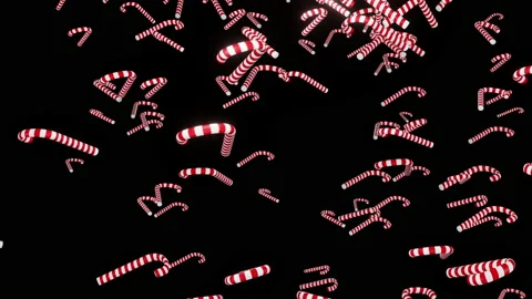 Falling dawn candy cane isolated on blac... | Stock Video | Pond5