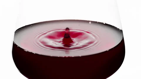 Falling drop of wine in slow motion. Win... | Stock Video | Pond5