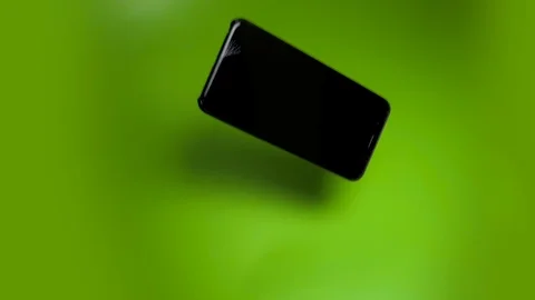 Falling, dropping smart phone. Green scr... | Stock Video | Pond5