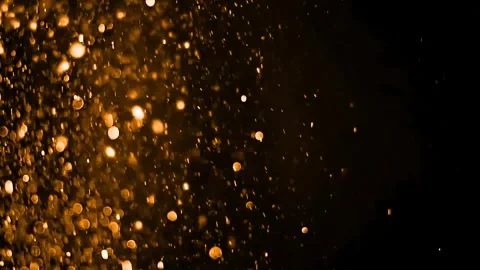 Falling golden glitter particles with sp... | Stock Video | Pond5