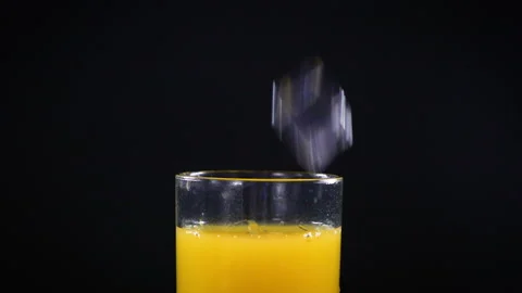 Falling ice cube and breaking glass | Stock Video | Pond5