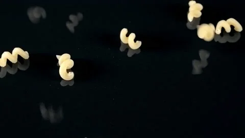 Falling pasta on black background | Stock Video | Pond5