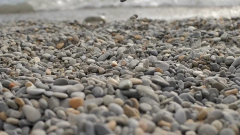 Falling pebbles on the background of the... | Stock Video | Pond5