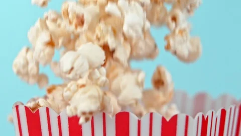 Falling popcorn in super slow motion on ... | Stock Video | Pond5