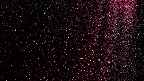 Falling red particles floating on a blac... | Stock Video | Pond5