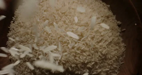 Falling Rice wooden bowl cup. Top view s... | Stock Video | Pond5