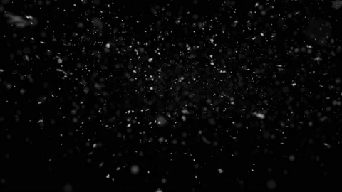 Falling snow on a black background in 4K... | Stock Video | Pond5