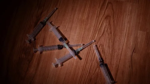 Falling syringes. Syringe drug abuse con... | Stock Video | Pond5