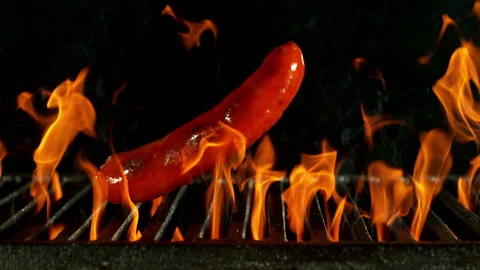 Falling Tasty Sausage on Cast Iron Grate | Stock Video | Pond5